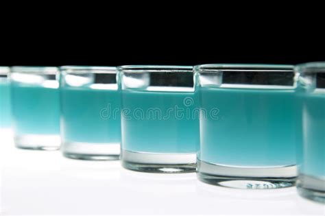 Shot Glasses Of Vodka With Lime Slice And Ice On White Background Stock