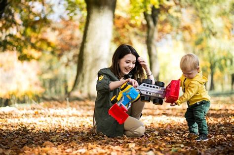 Free Photo Mother And Son In Autumn Park