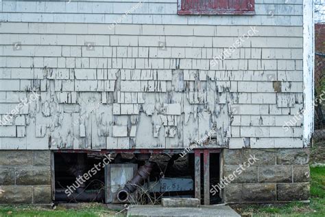 Abandoned Building With Extreme Severe Wood Shingle Deterioration In
