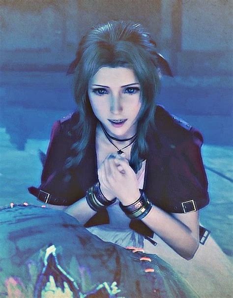 A Woman With Long Hair And Bracelets Sitting On The Ground