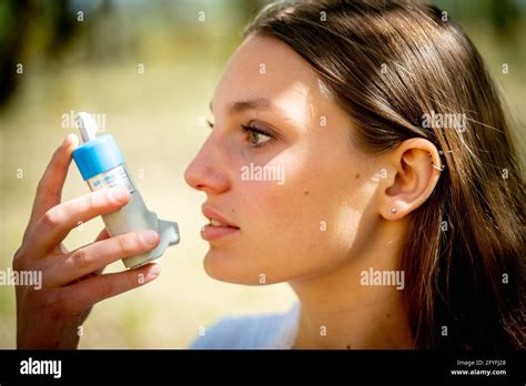 Woman Using An Inhaler Stock Photo Alamy