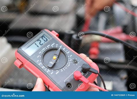 Auto Mechanic Check Car Battery Voltage By Voltmeter Multimeter Stock Image Image Of Maintain