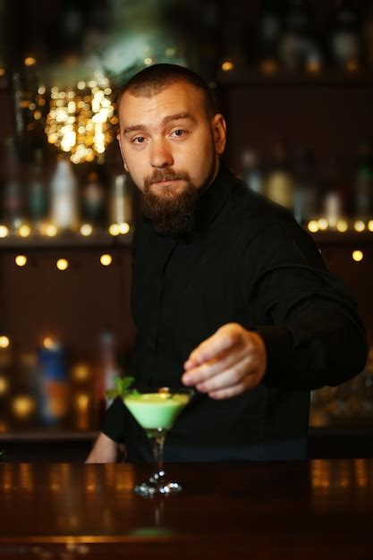 Premium Photo Bartender Making Cocktail