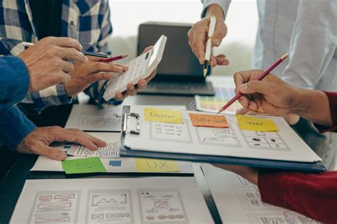 A Team Of Ux Designers Works On A New Website Layout Plan Mobile Web Application Development In