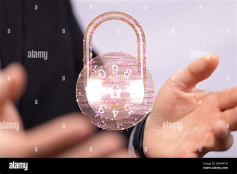A Persons Finger Touching A 3d Rendered Security Concept With Floating Padlock And Binary Code