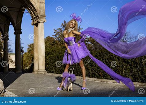 Elegant Young Blonde Woman In Summer Dress And High Heels Seductively