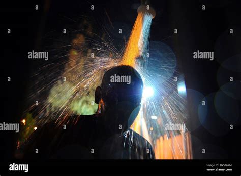 A Hindu Devotee Gets Showered As Part Of A Cleansing Ritual Before
