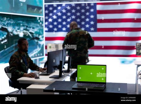 American Army Working In A Command Post With Green Screen Soldiers