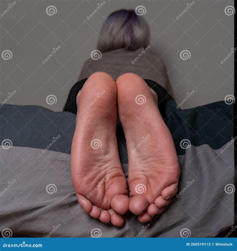 Closeup Of The Soles Of Female Feet Lying In A Bed Stock Image Image