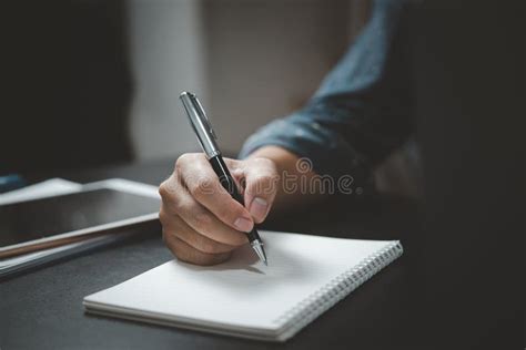 Learning Online Class By Using Laptop Computer And Writing Notebook At