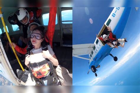 女孩去跳伞被教练抱着出仓，身子都吓软了，真是花钱找刺激