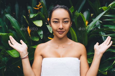 Charming Female Model With Raised Hands Posing Outdoors Cosmetology