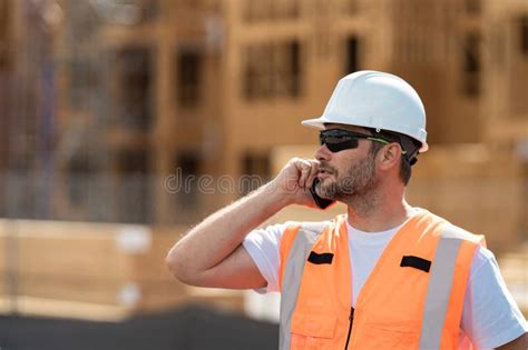 Worker Using Phone Builder Taking On Phone A Break From Work Architect With Mobile Phone Stock