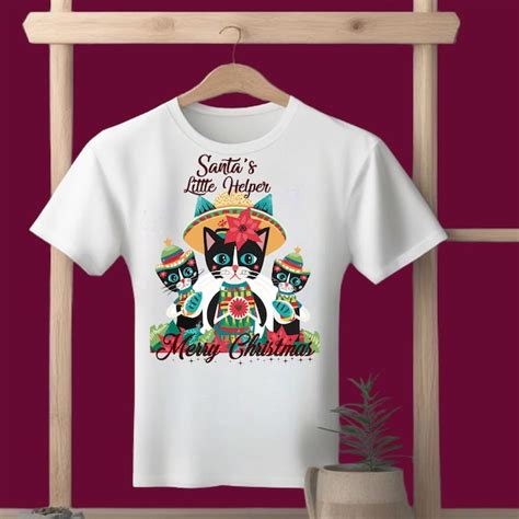 Premium Vector A Cute Cat Merry Christmas Tee Shirt Wearing A Santa