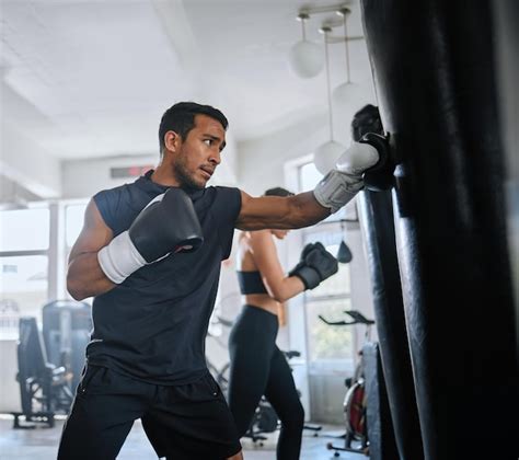 Premium Photo Active Fit And Serious Man Boxing Sweating And Doing A