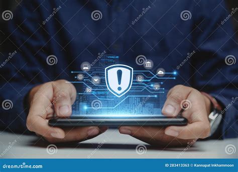 Businessman Holding Smartphone With Caution Warning Sign Stock Image