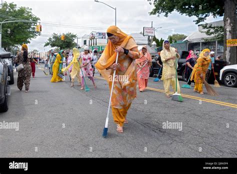 Devout Sikh Men And Women Sweep 101 Avenue Where A Parade Float Carry