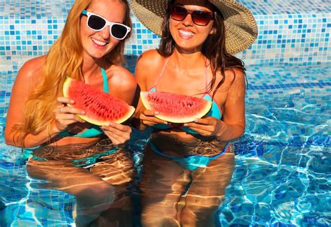 Young Woman Wearing Sunglasses At Swimming Pool Premium Photo