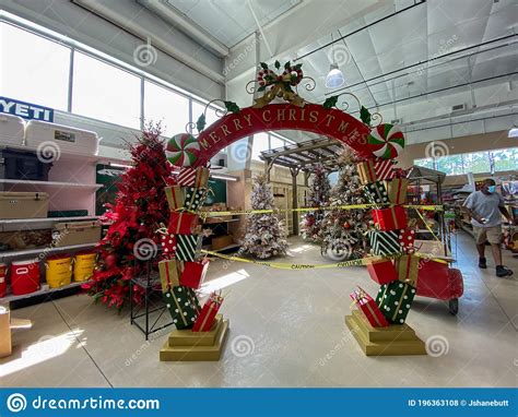 A Christmas Decor Display Being Constructed At An Ace Hardware Retail