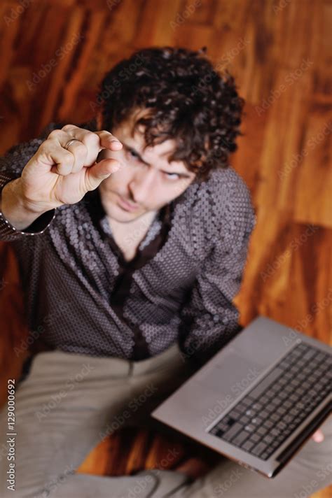 Young Guy Looking For Information On The Internet About The Size Of The