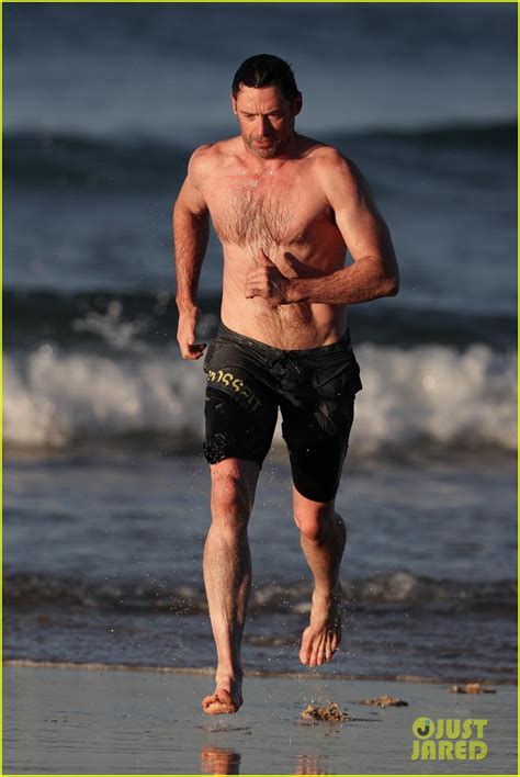 Hugh Jackman Runs Shirtless On The Beach With His Ripped Muscles On