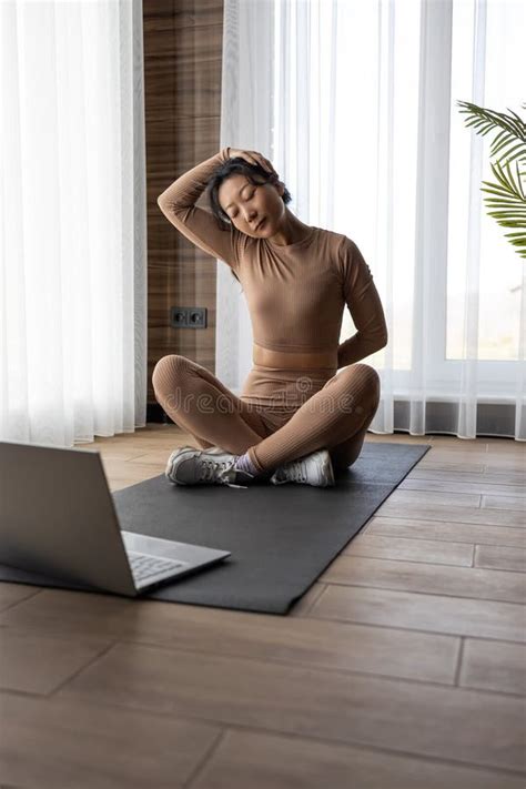 Attractive Young Asian Woman Doing Yoga Stretching Yoga Online At Home