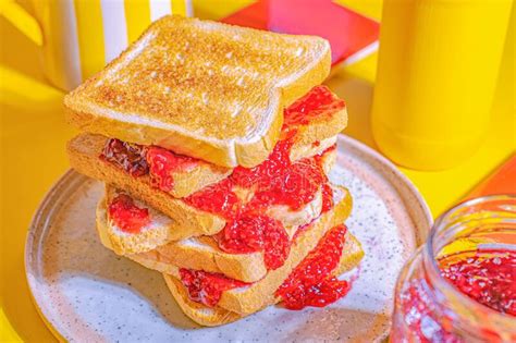 Closeup Shot Of A Stacked Strawberry Jelly Sandwich With Lots Of Bread