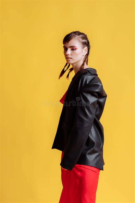 Beautiful Female Model In A Red Dress Yellow Background Stock Image