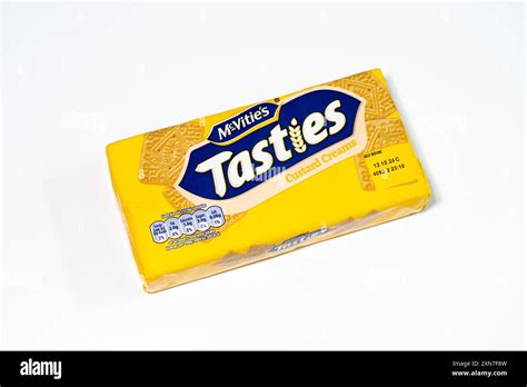 A Packet Of Mcvities Tasties Custard Creams On White Background Stock