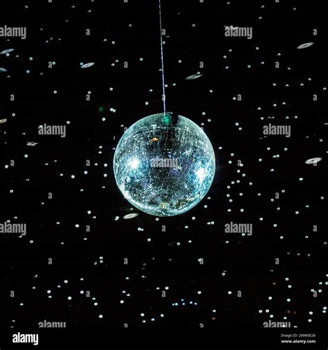 Bright Glowing Disco Ball With Reflections Around Stock Photo Alamy