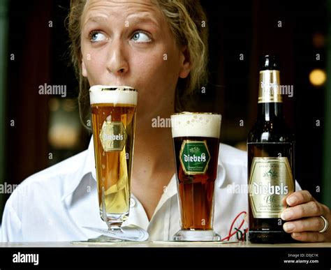 Dpa Waitress Steffi Has A Taste Of The New Pilsener Beer From The Diebels Brewery In Issum