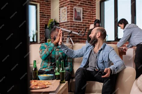 free photo diverse team of friends doing highfive gesture after