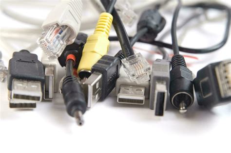 A Hand Holding Several Different Types Of Cables Stock Photo At Vecteezy