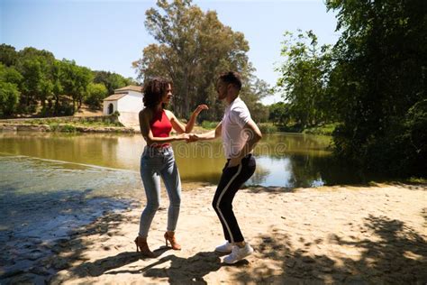 Beautiful Woman And Handsome Man Latinos Dancing Bachata Are Dancing By