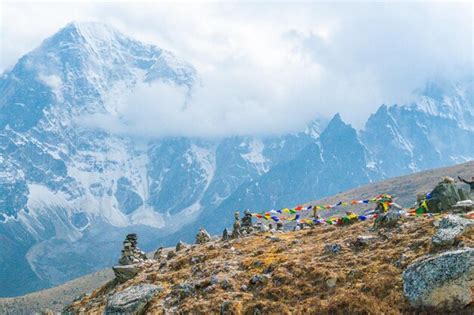 Premium Photo Trekkers And Colorful Prayer Flags On The Everest Base