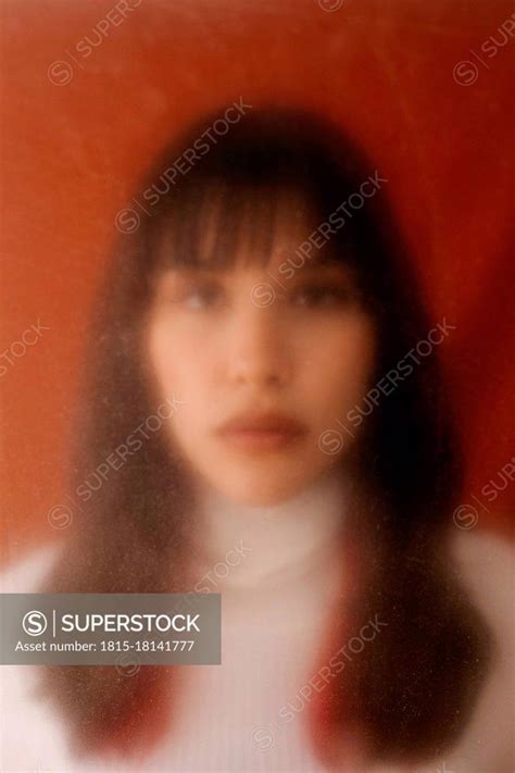 Young Woman Behind Plastic Sheet Superstock