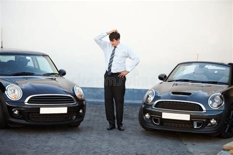 Business Man Thinking And Choice Of Car At Dealership Shop And Store