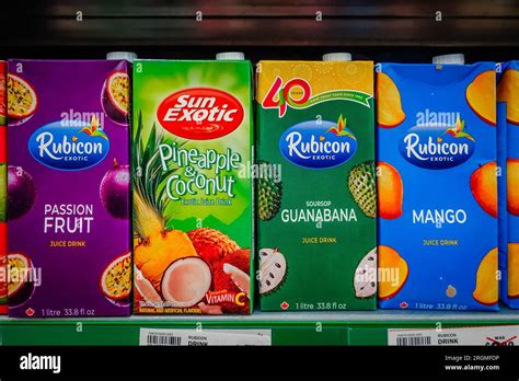 Carton Box Containers Of Exotic Fruit Juices On A Supermarket Shelf