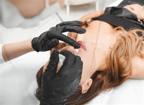 Premium Photo Female Lips Lip Augmentation Procedure A Syringe Near A Woman S Mouth Injections