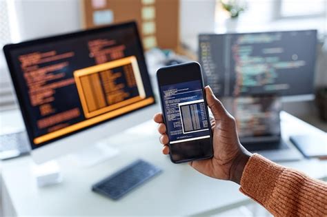 Premium Photo Hand Of Developer Showing Smartphone With Code Of New
