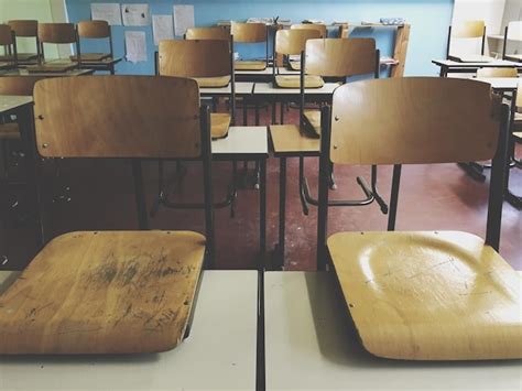 premium photo empty chairs and tables in classroom