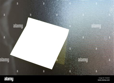 Piece Of Square Paper Use To Give Notation Stick To Textured Glass