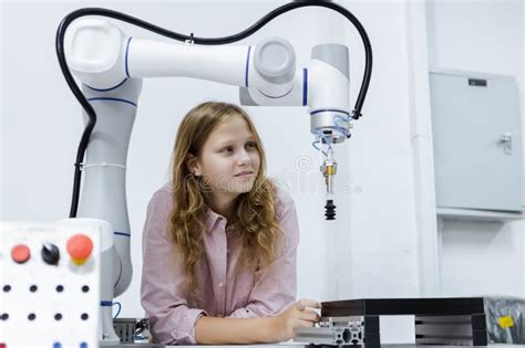 Girl Caucasoid Education Electronic Robotic Arm On Table At Class Room
