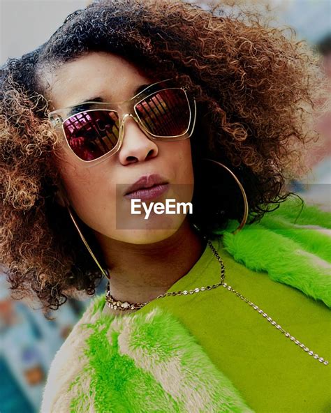 Portrait Of Young Woman Wearing Sunglasses Id 212452417