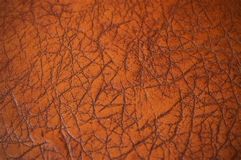 Premium Photo Wrinkles On A Brown Leather Product Closeup