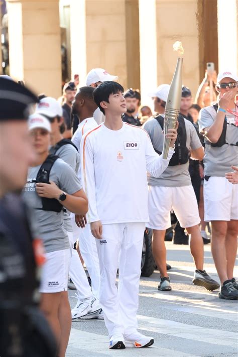 Btss Jin Lights Up Paris At Olympic Torch Relay