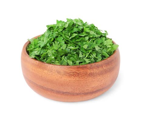 Chopped Parsley Leaves In Wooden Bowl Isolated On White Stock Image