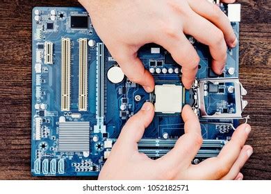 Computer Motherboard Cpu Installing Processor Stock Photo 1052182571