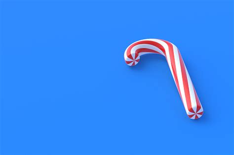 크리스마스 지팡이 파란색 배경에 빨간 줄무늬사탕 새해 축하 개념 전통적인 달콤한 디저트 공간을 복사합니다 3d 렌더 3차원