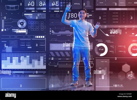 Positive Web Developer Smiling And Touching The Transparent Screen Stock Photo Alamy